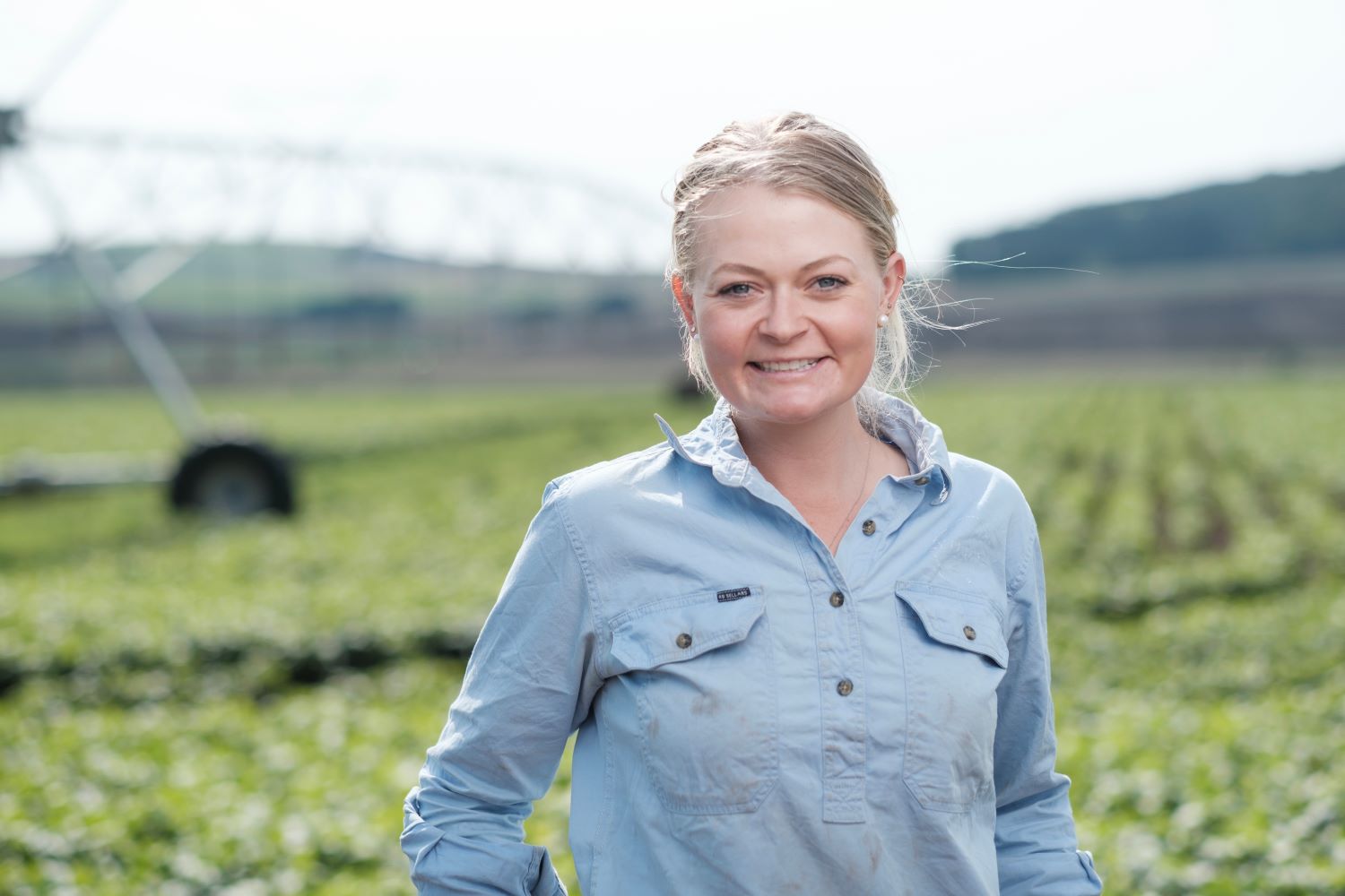 Caitlin in a bean field